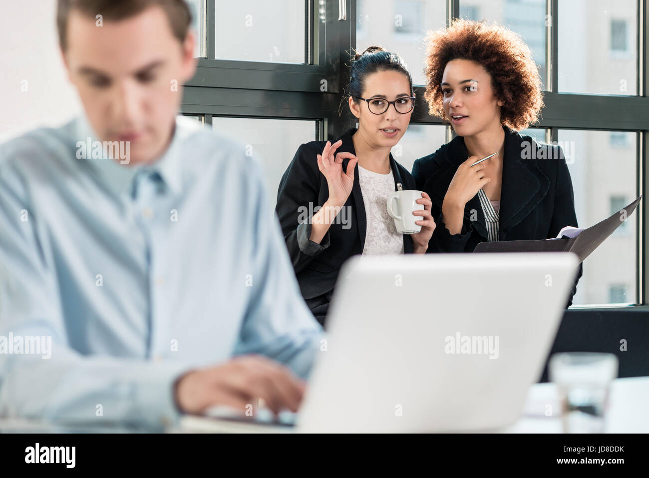 Office talking secret hi-res stock photography and images - Alamy