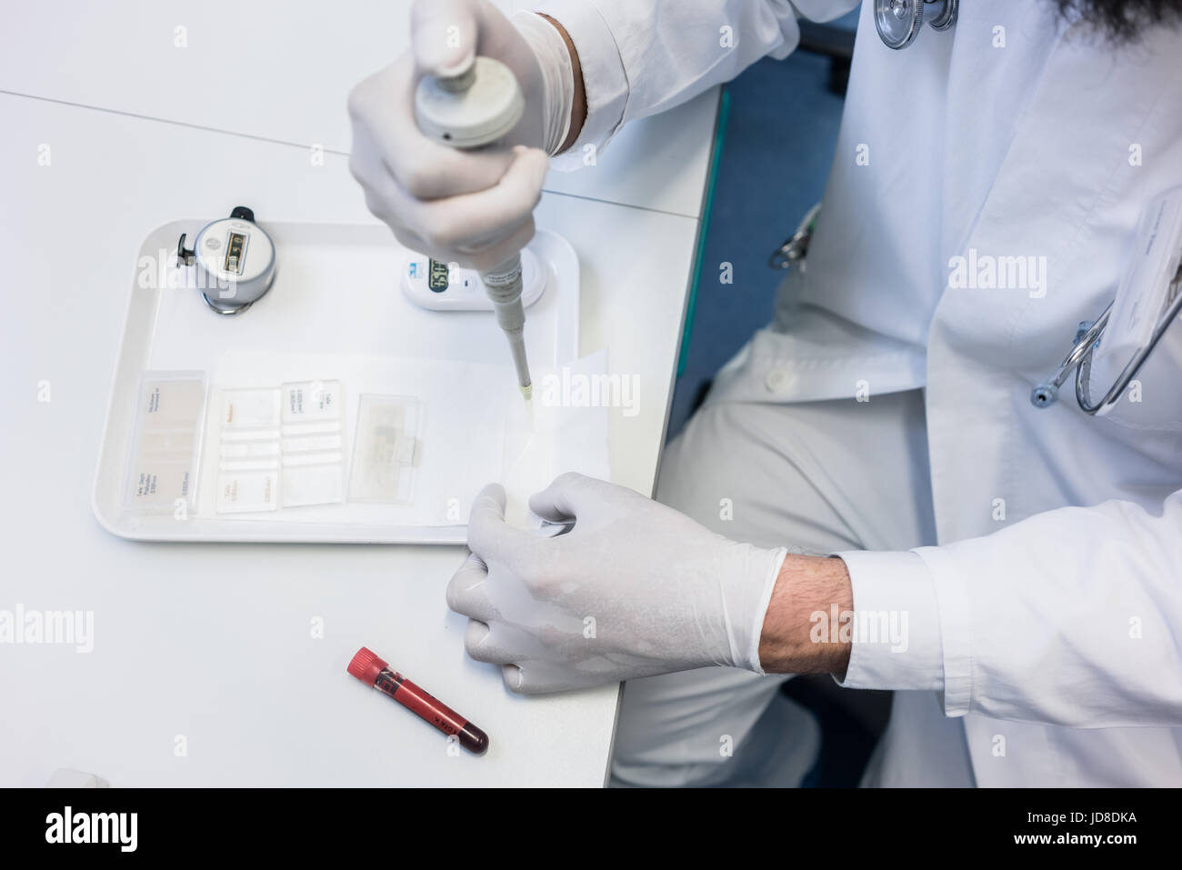 Scientist in lab coat preparing hi-res stock photography and images - Alamy