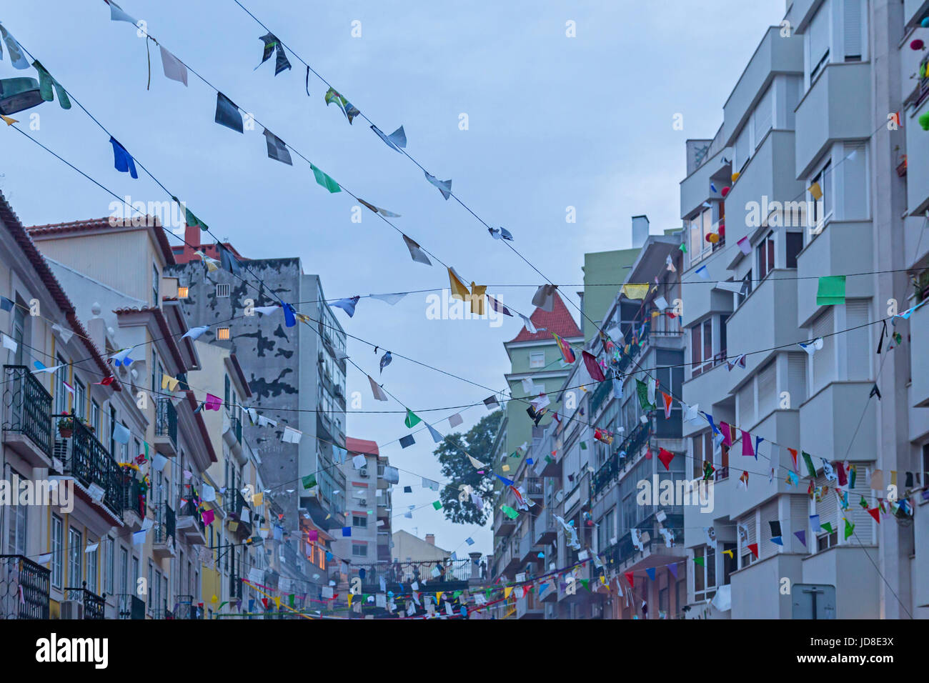 festive city street with decoration of the flags in evening time Stock ...