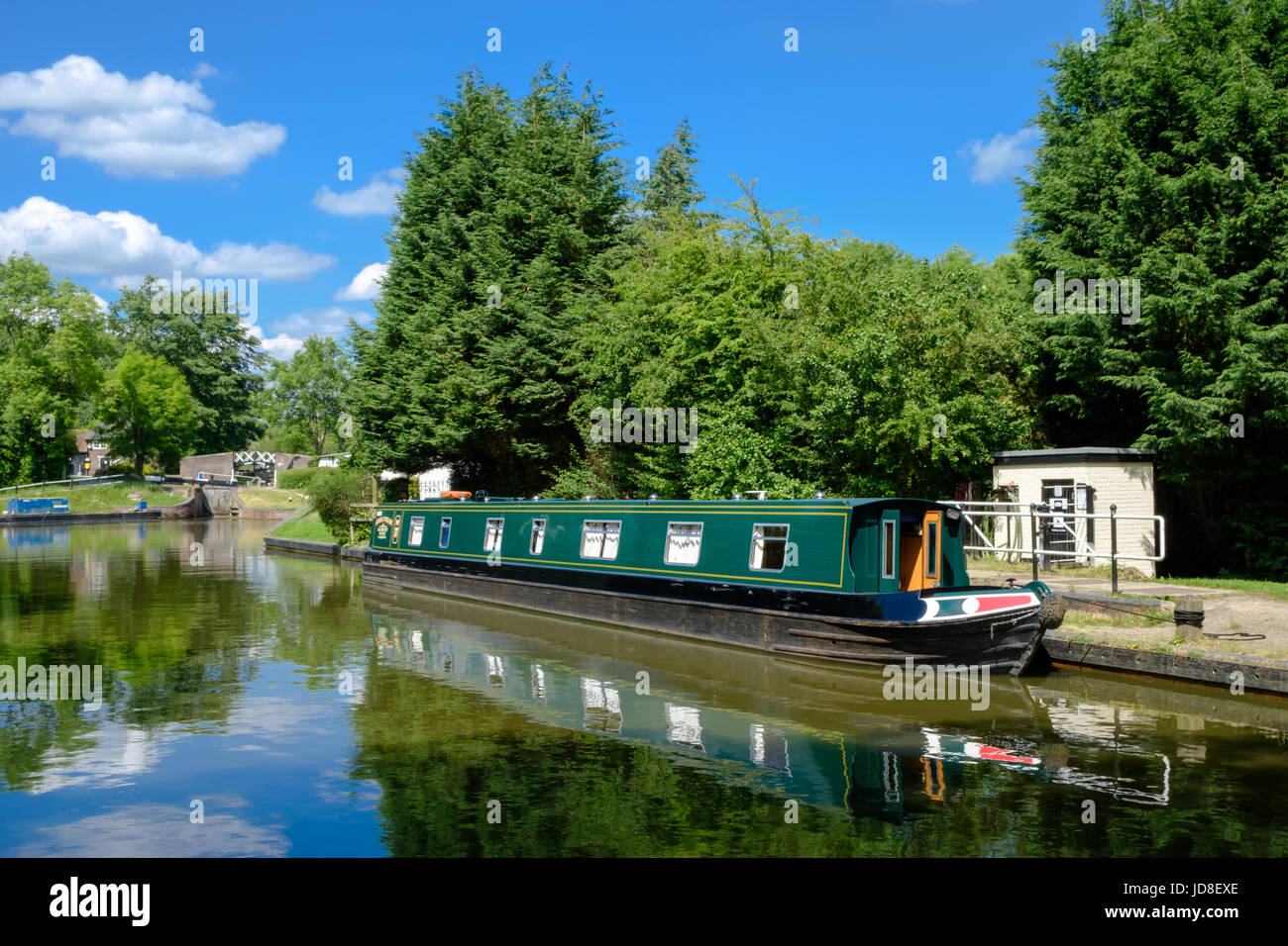Green canal boat in Birmingham canal at Lapworth Stock Photo - Alamy