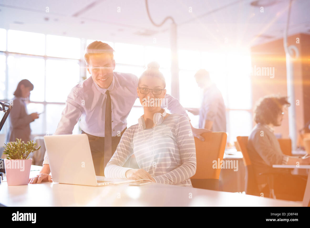 Company team smiling helping colleague hi-res stock photography and ...