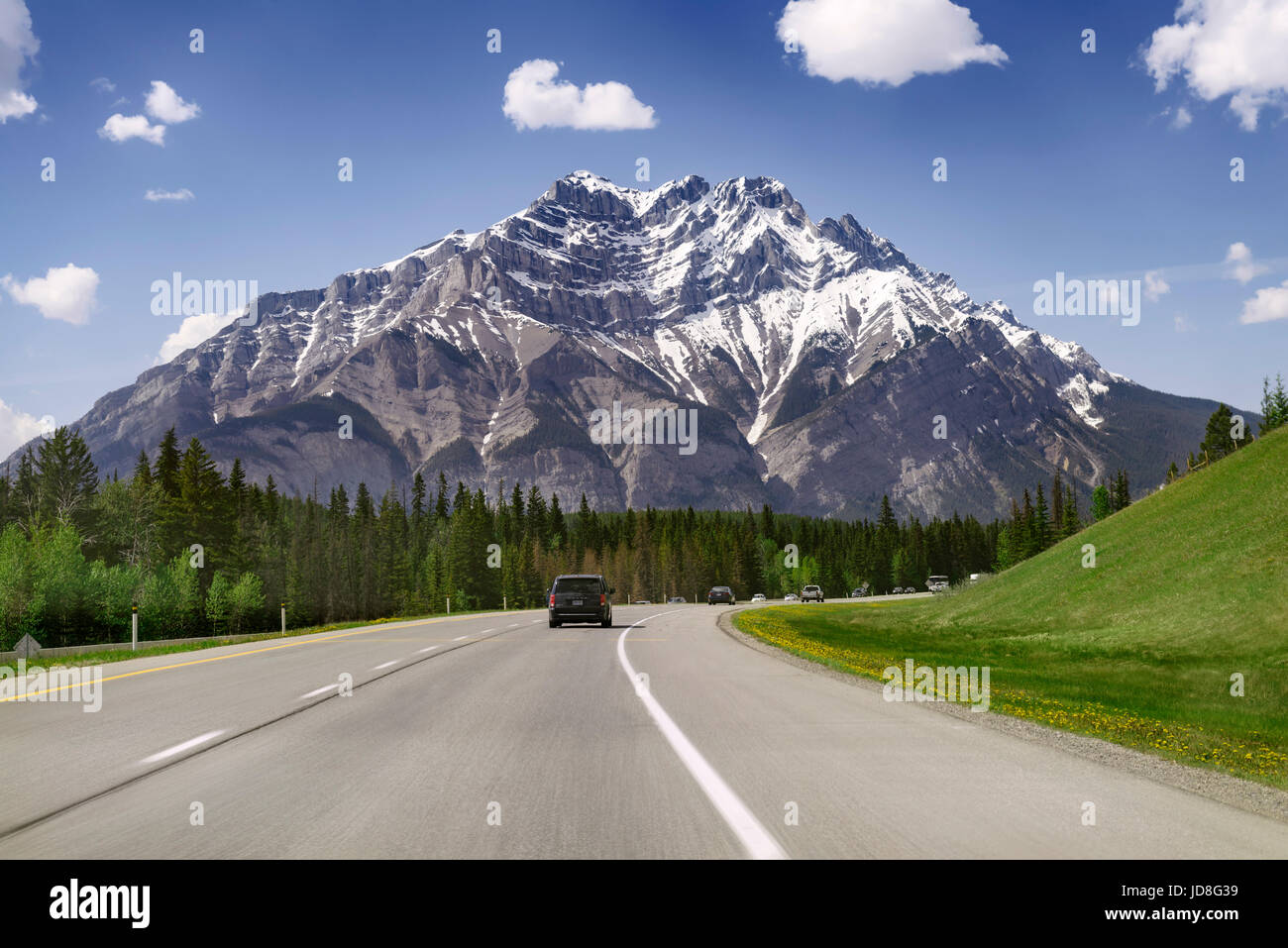 Cars on Trans-Canada highway traveling through Alberta's Rockies, Banff Provincial Park. Rocky ...