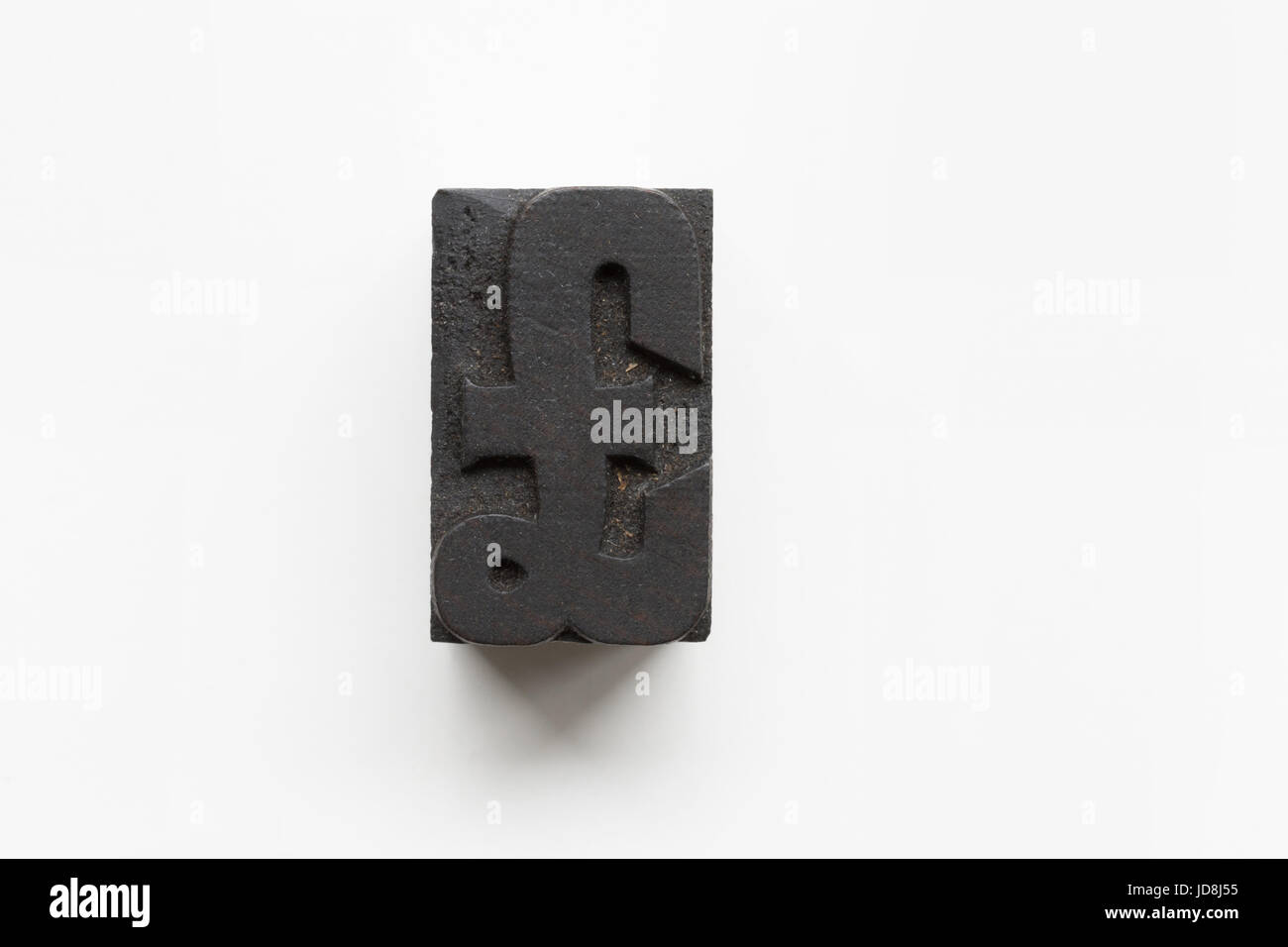 Old letterpress pound sign printing block isolated on a white ...