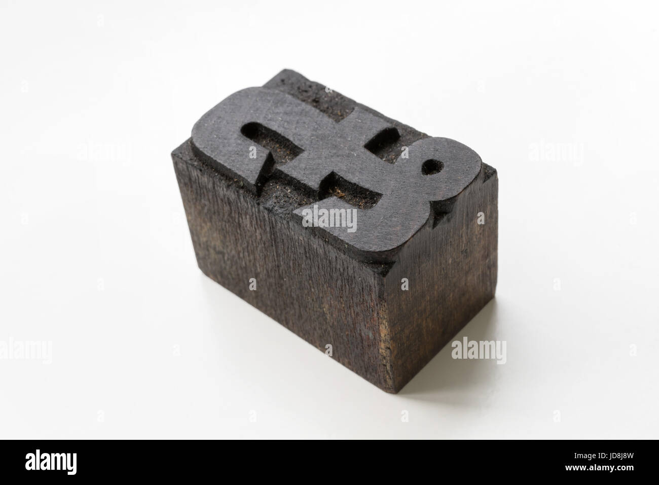Old letterpress pound sign printing block isolated on a white ...