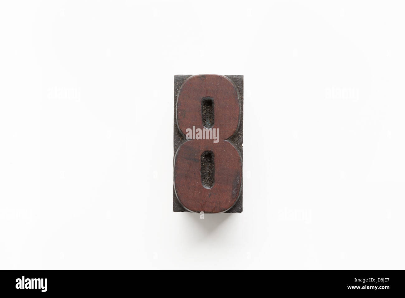 Old letterpress number eight printing block isolated on a white ...