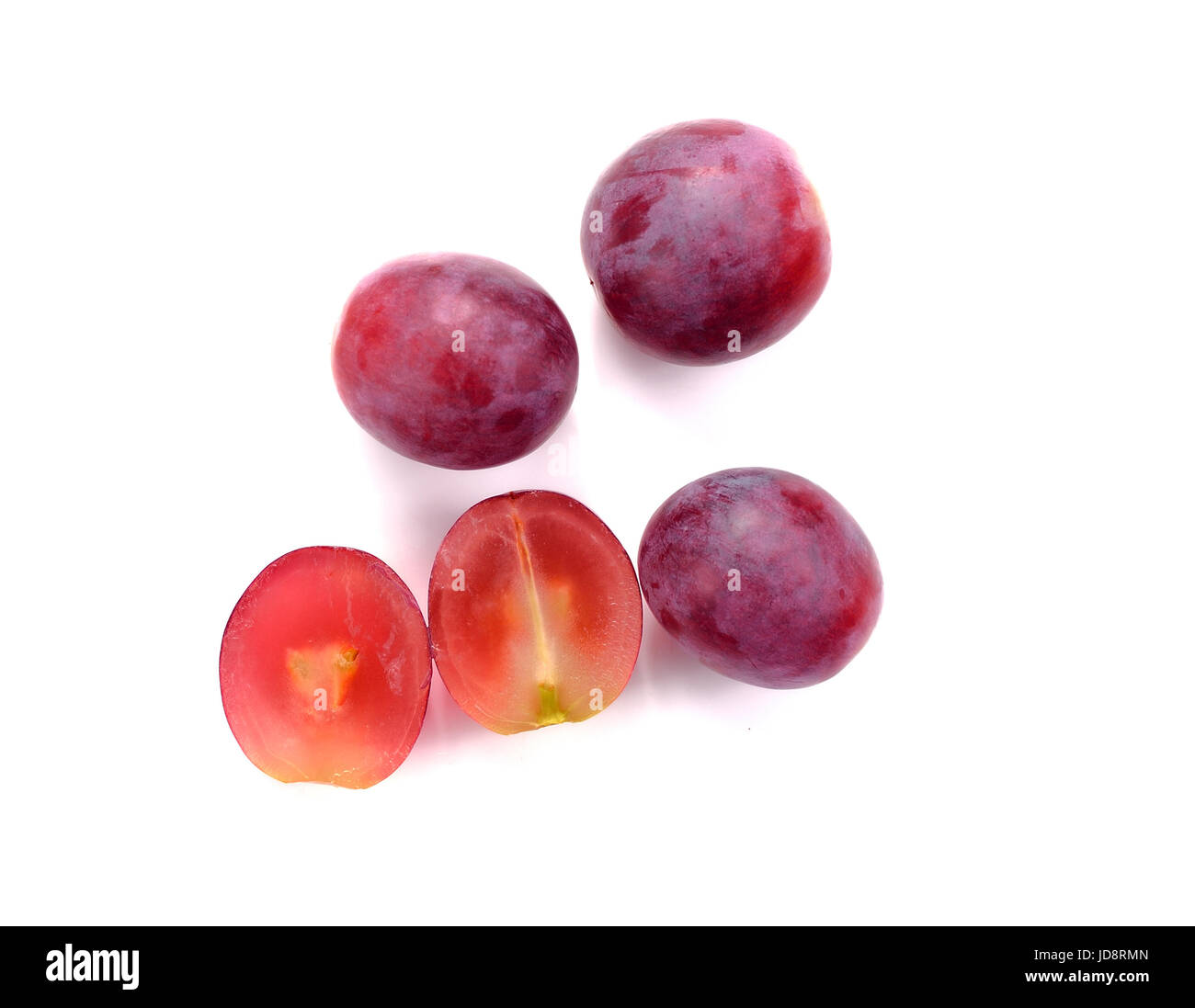 Red grape sliced in a half isolated on a white background Stock Photo ...