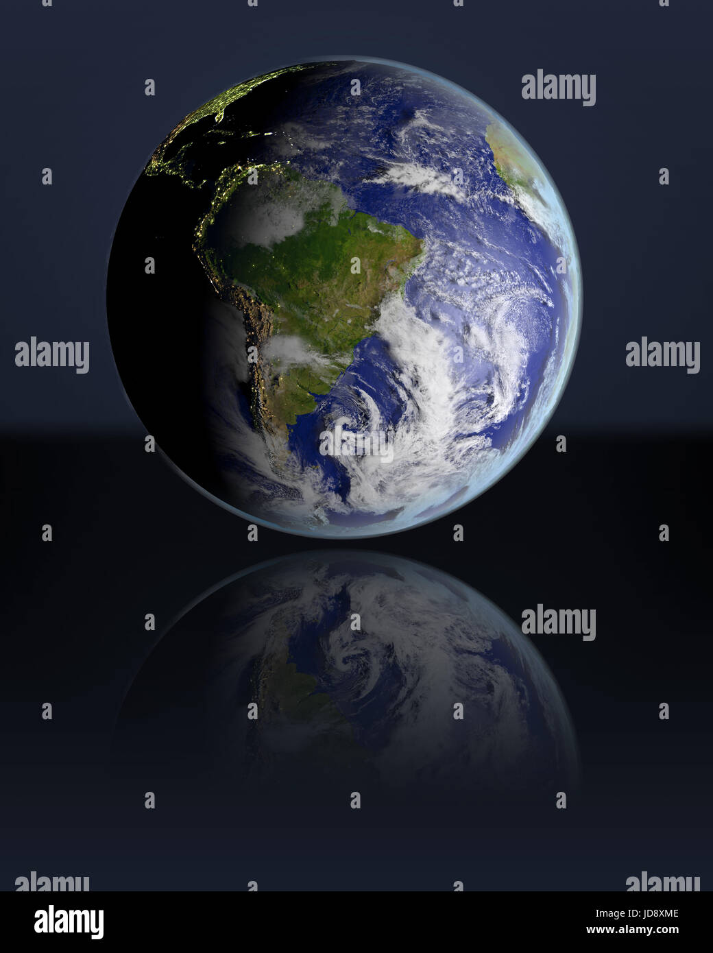 Planet Earth hovering above dark reflective surface facing South ...
