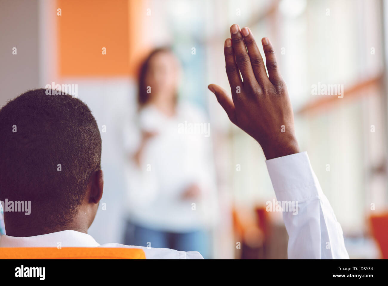 African american Business people Raising there Hand Up at a Conference ...