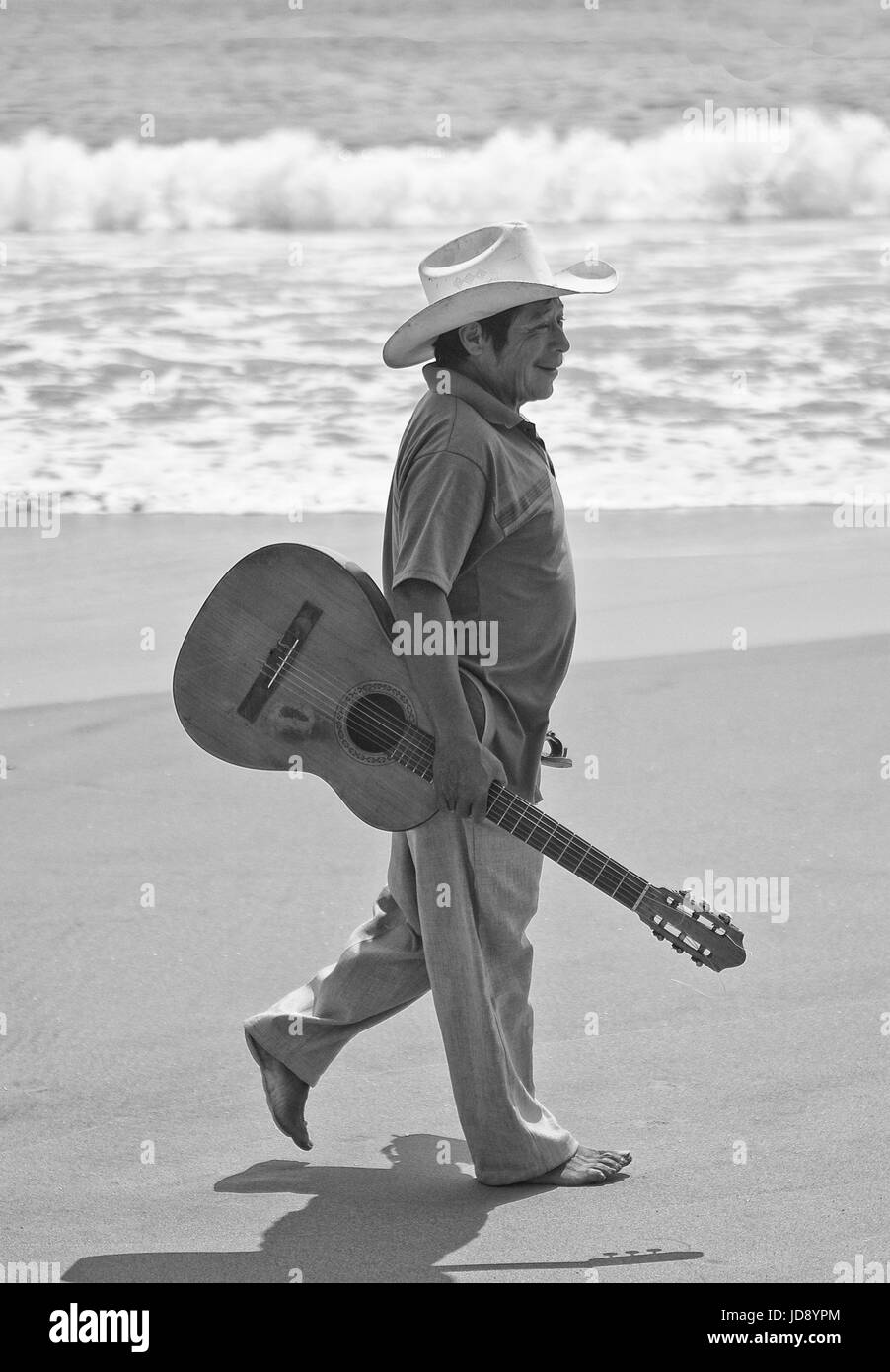 Mexican Musician Walkin On The Beach Of Manzanillo Colima. Mexico Stock ...