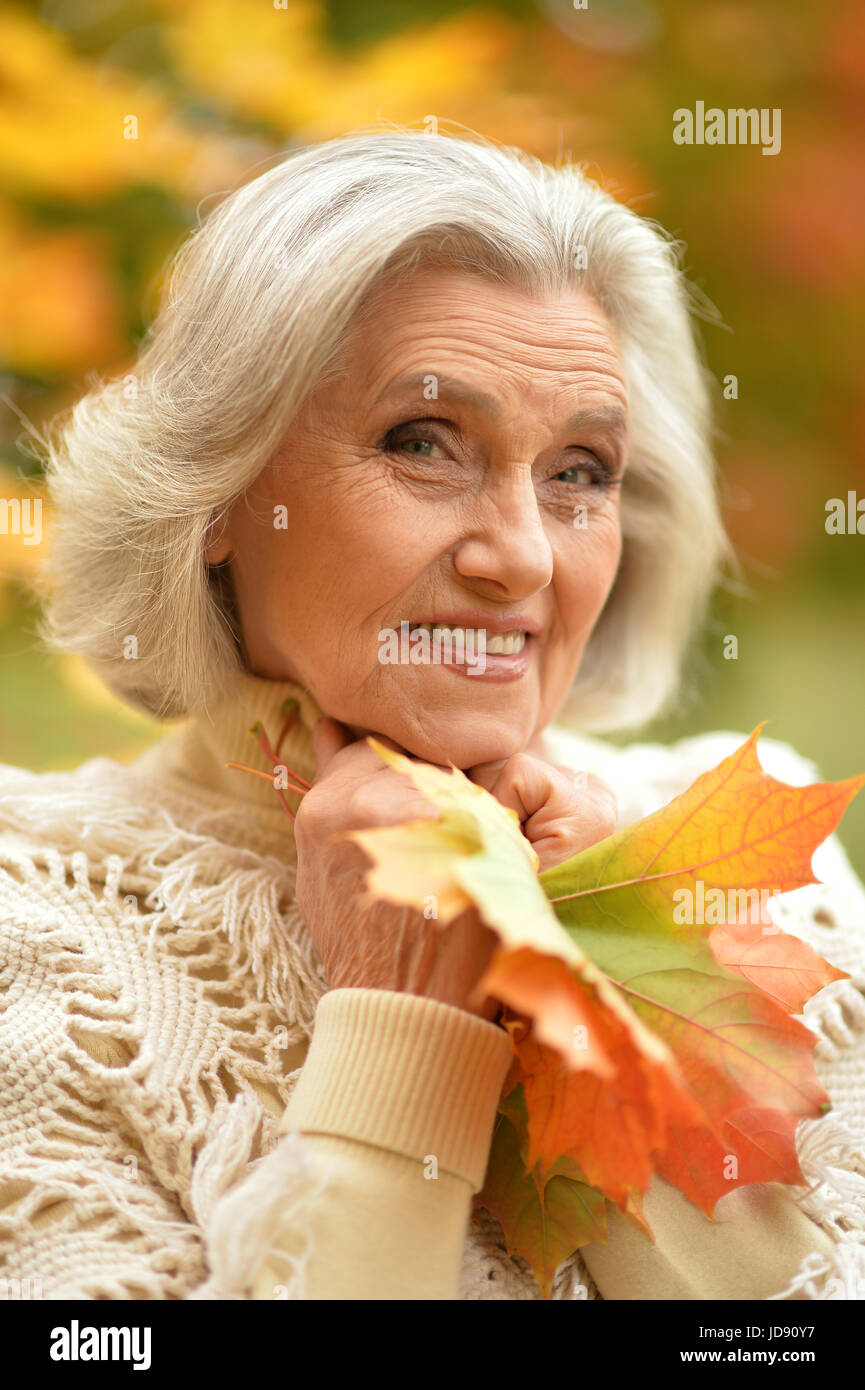 Portrait of a beautiful senior woman outdoors Stock Photo - Alamy