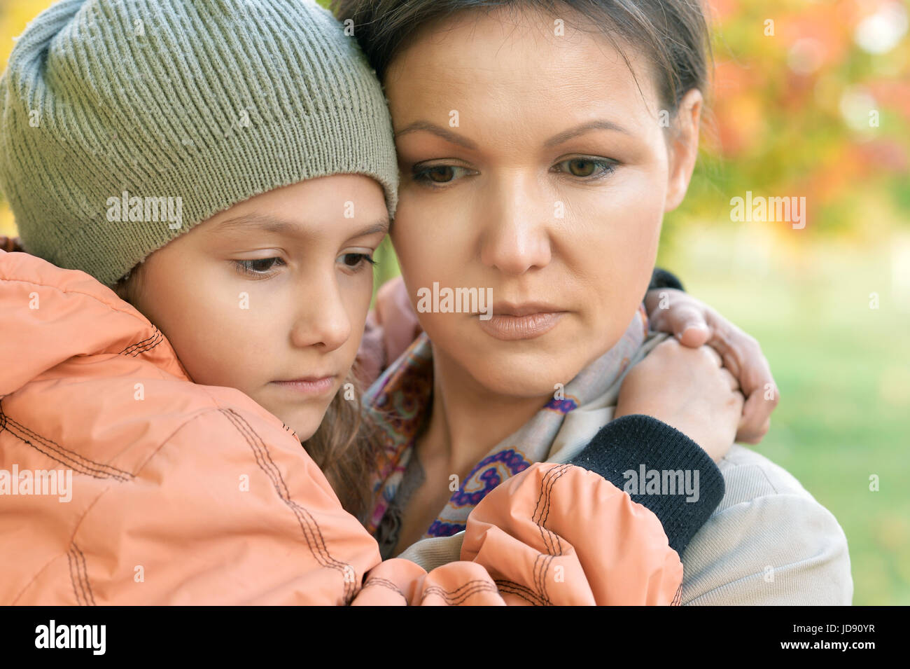 Mother hugging daughter sad hi-res stock photography and images - Alamy
