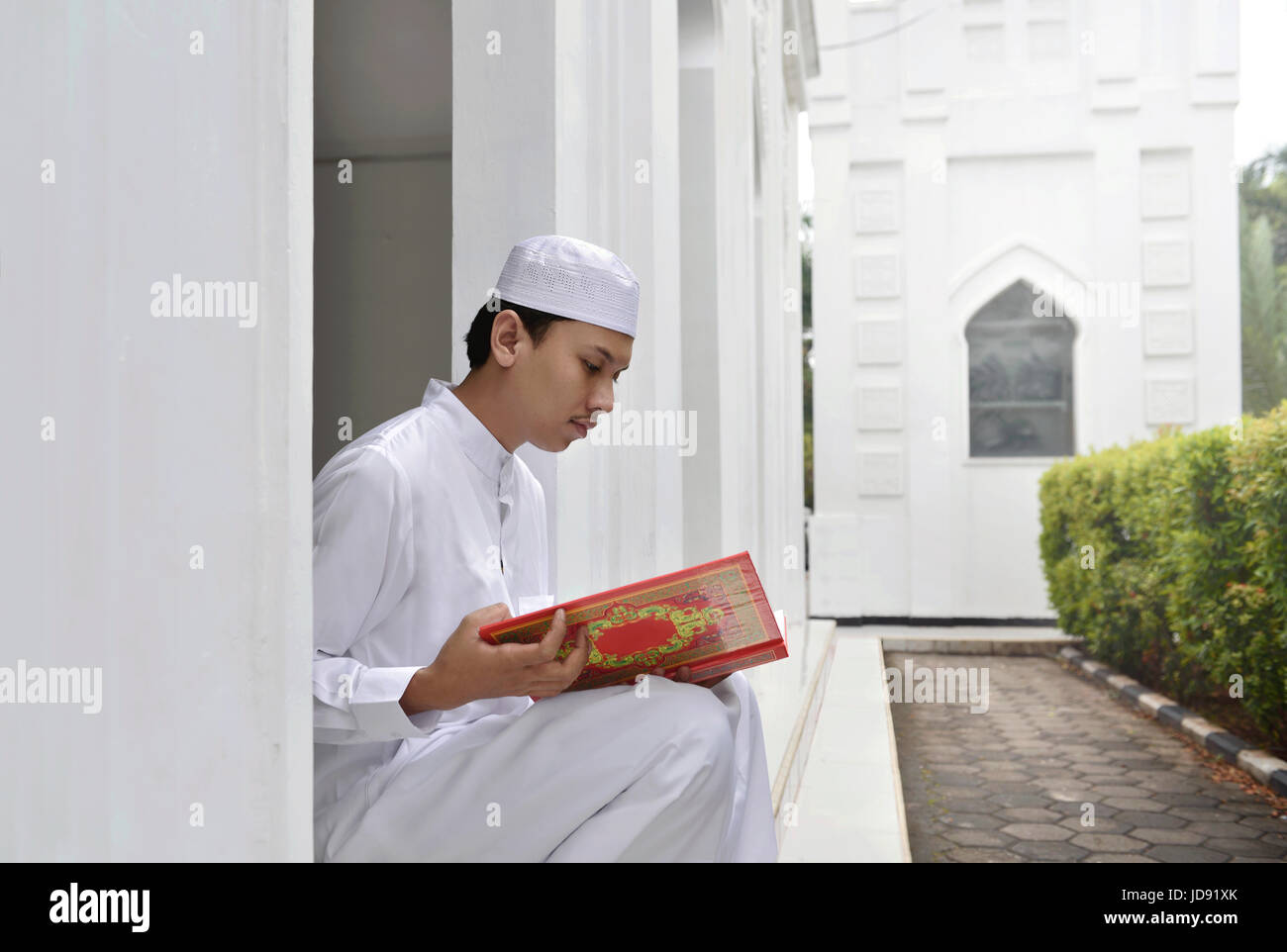 Muslim man reading quran in the mosque hi-res stock photography and ...