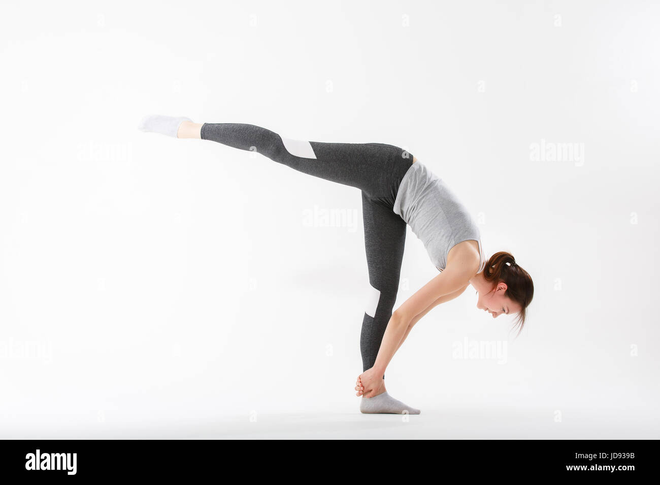 Young woman exercise yoga supported headstand Stock Photo - Alamy