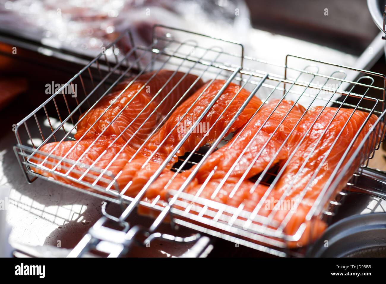 Fish on bar for barbecue Stock Photo - Alamy