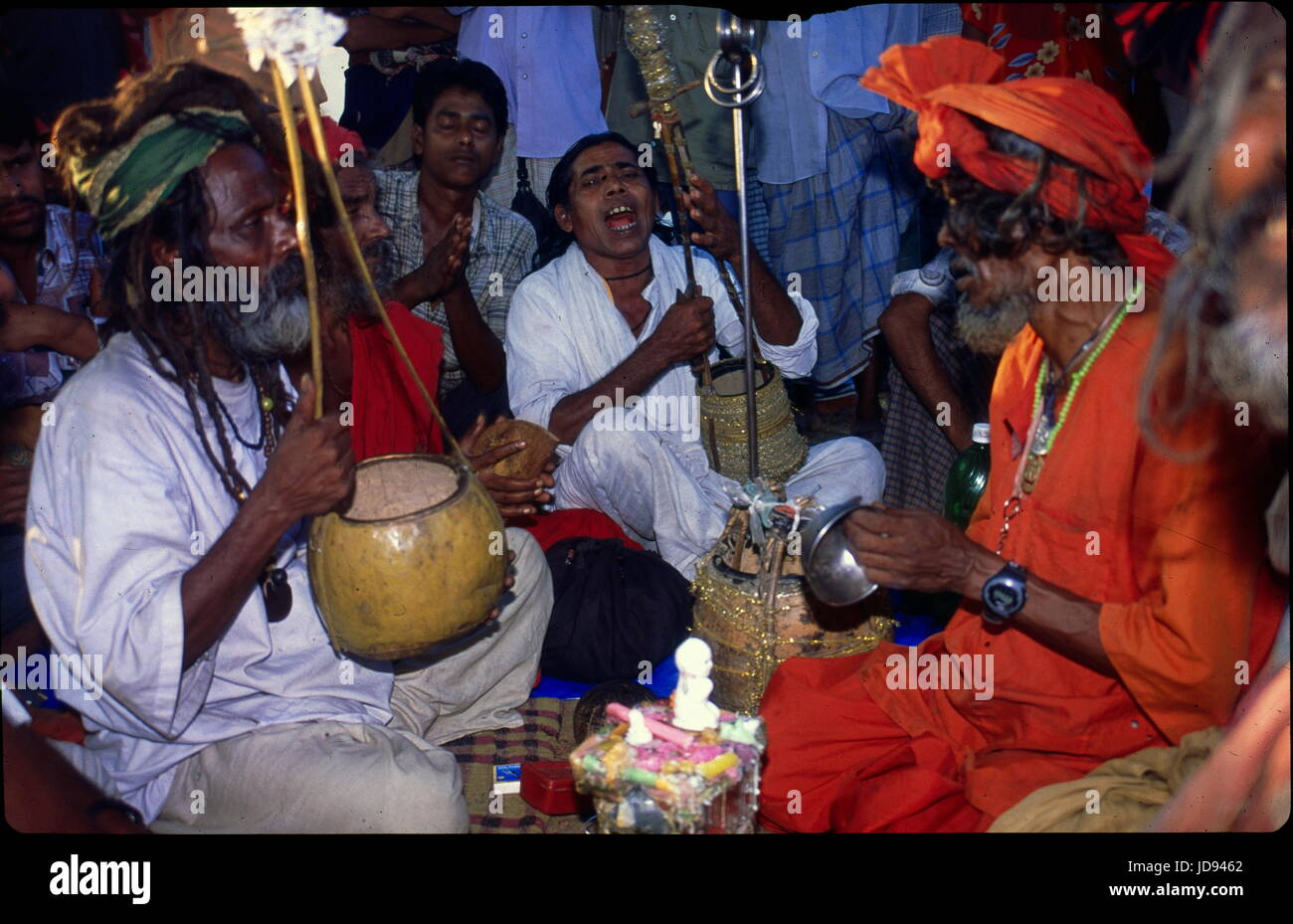 the baul artist presenting their baul (folk) song in the grave yard ...