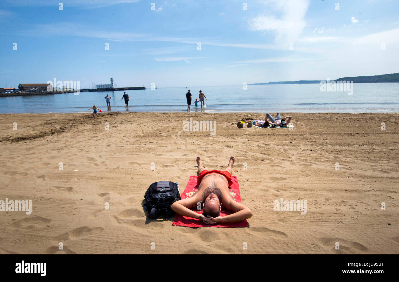 People enjoy the hot weather on the beach in Scarborough, North ...