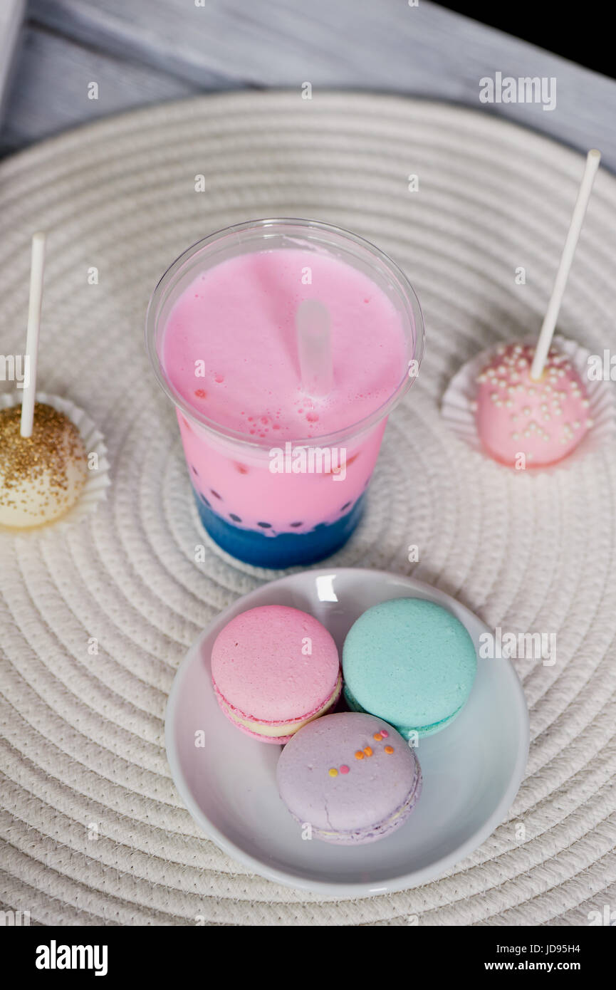 bubble tea in pink and blue color in a plastic Cup with a straw. Soft ...