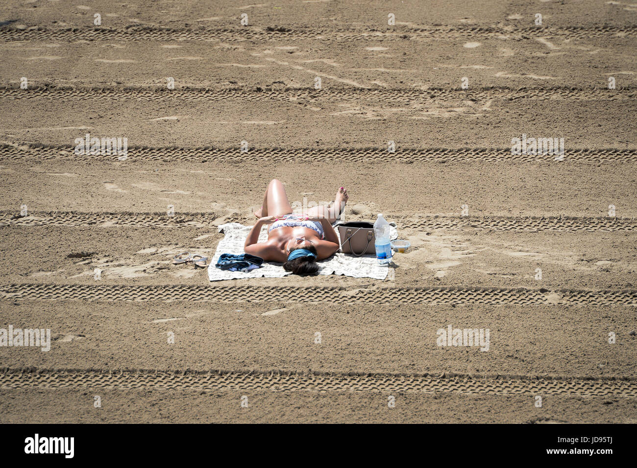 Sunbathers on the beach at Barry Island, South Wales, where ...