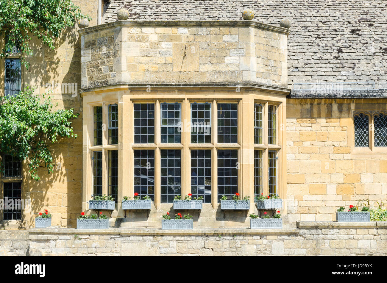 Stone bay window with leaded glass at The Lygon Arms hotel in the ...