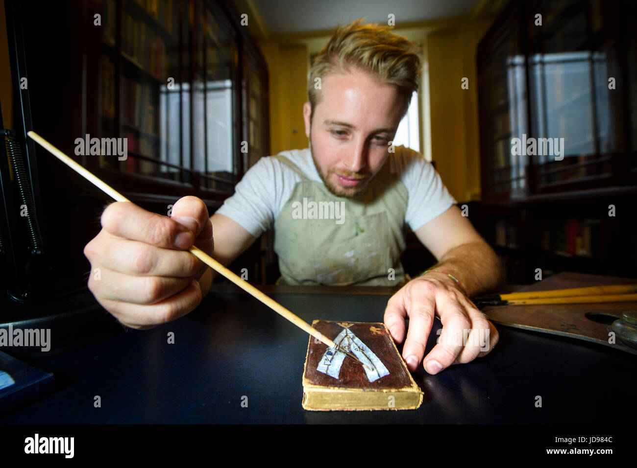 Artist Jacques Viljoen pictured working in Freemasons' Hall in central ...