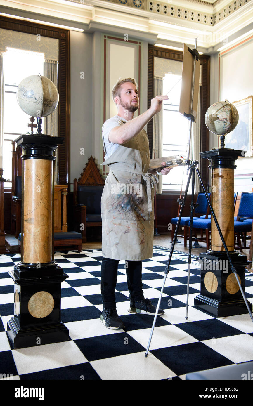 Artist Jacques Viljoen pictured working in Freemasons' Hall in central ...