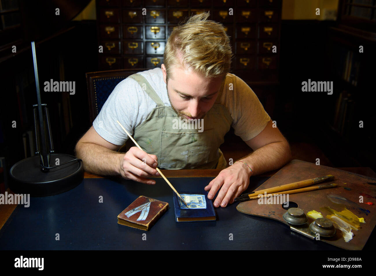 Artist Jacques Viljoen pictured working in Freemasons' Hall in central ...
