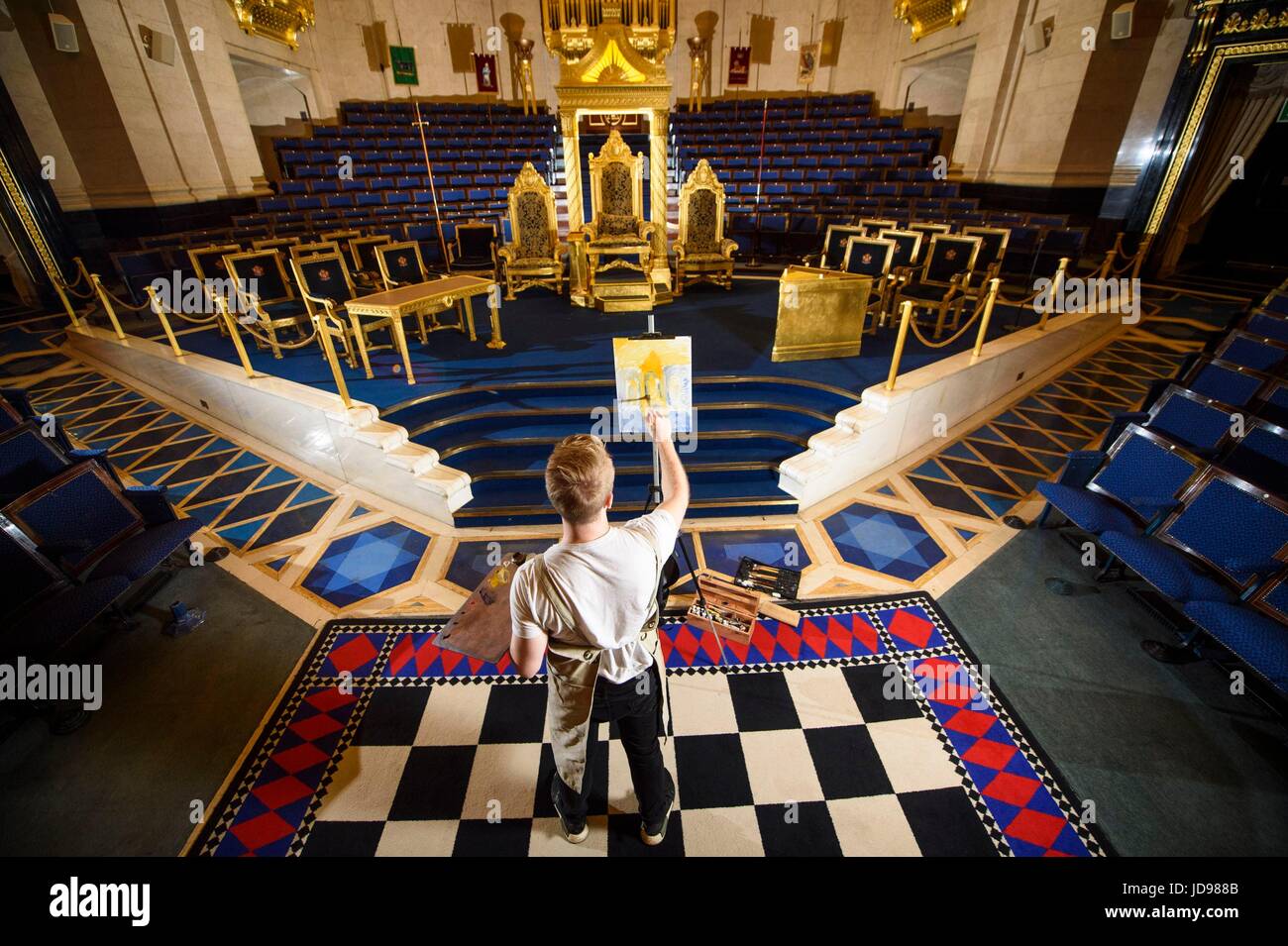Artist Jacques Viljoen pictured working in Freemasons' Hall in central ...