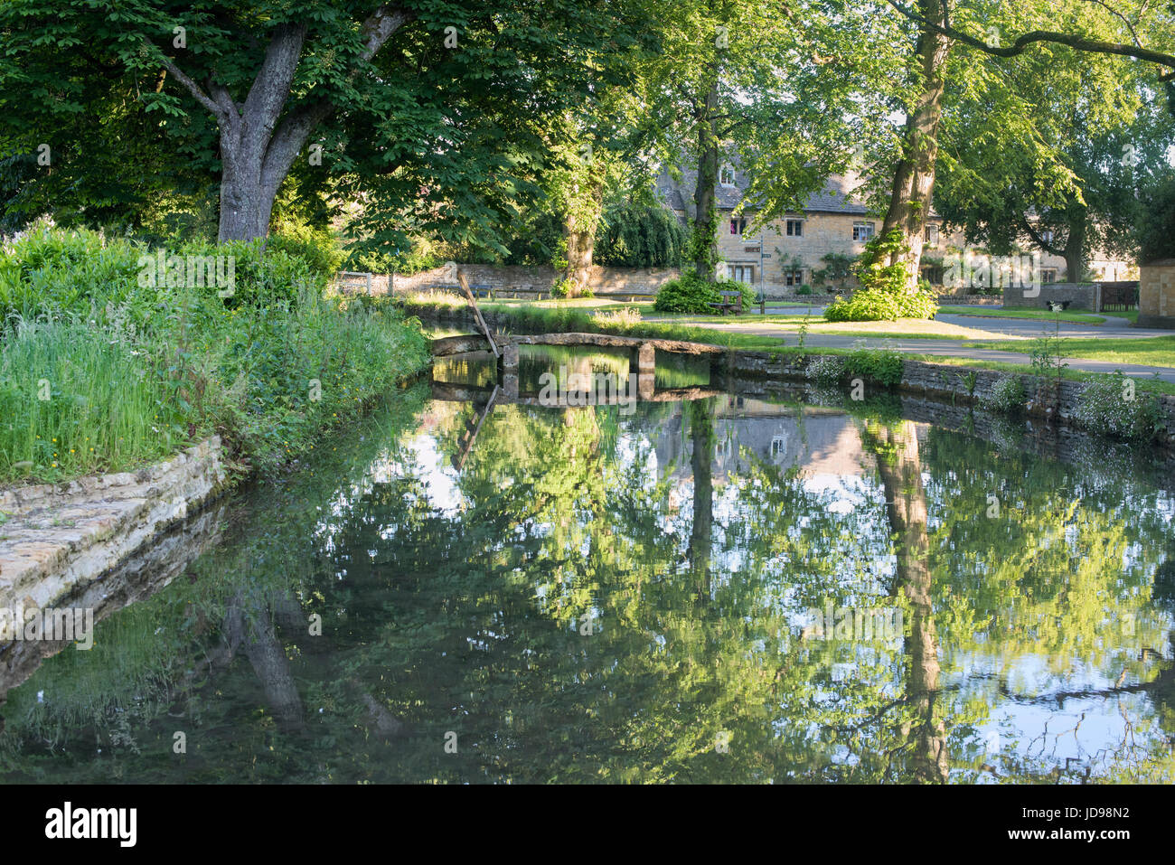 River eye and reflections in Lower Slaughter in the early morning june ...