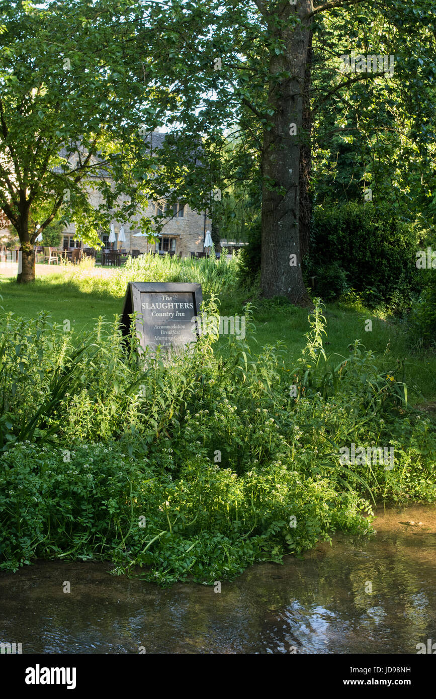 The slaughters country inn sign in the early morning june sunshine ...