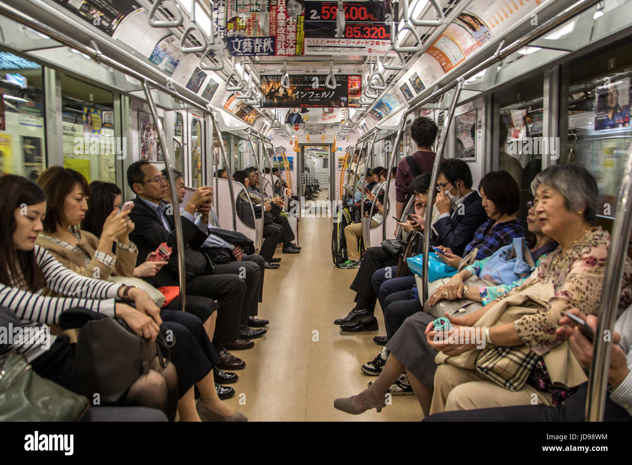 TOKYO, JAPAN - OCTOBER 12, 2016: Unidentified people in Tokyo subway ...