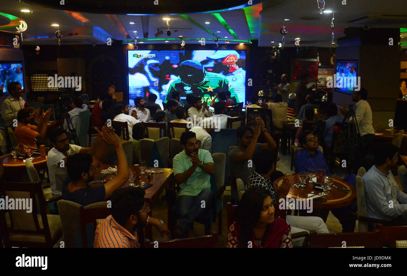 Lahore, Pakistan. 19th June, 2017. Pakistani cricket fans watch the ...