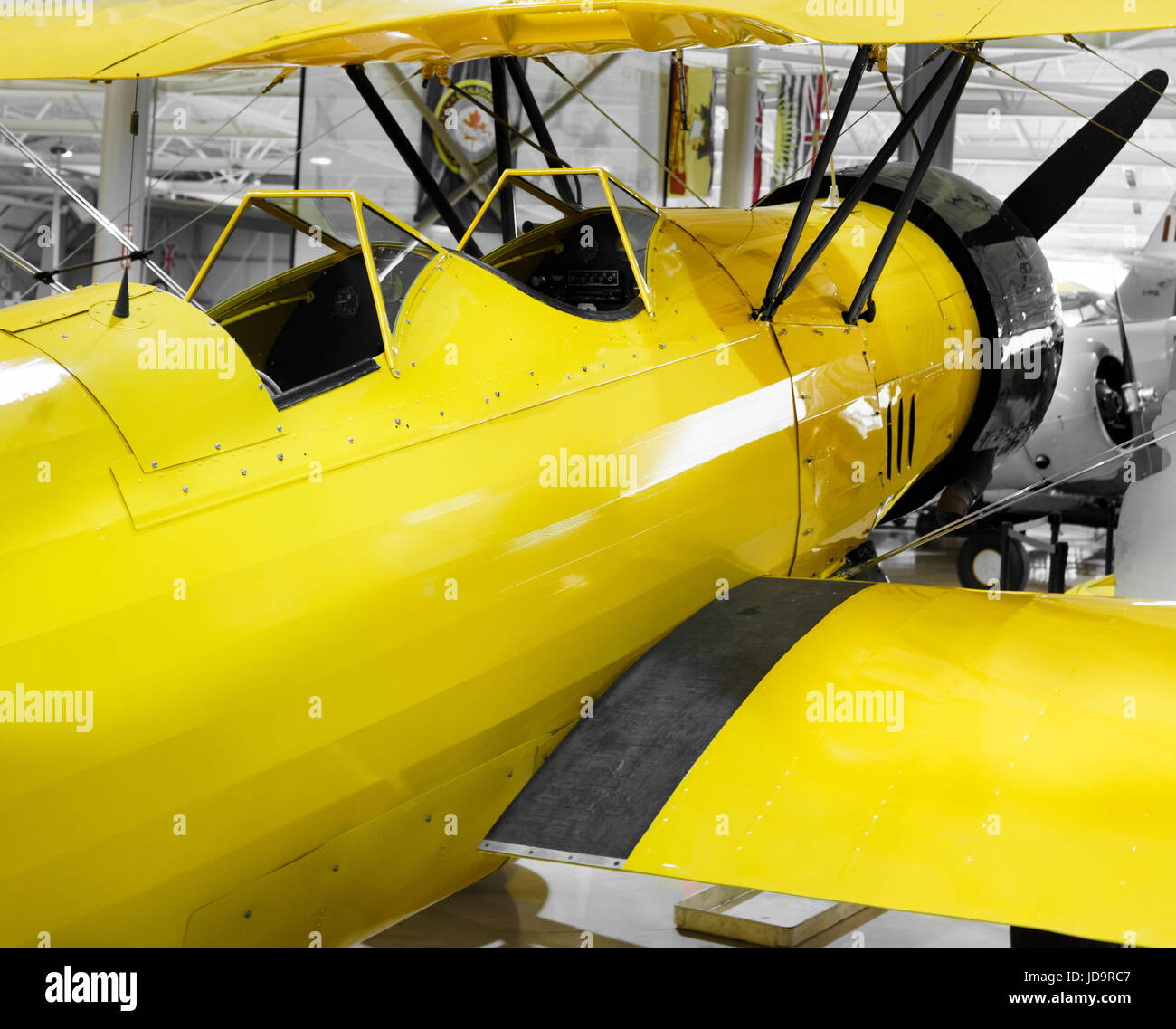 Part of restored, stationary aeroplane, yellow painted propeller plane ...