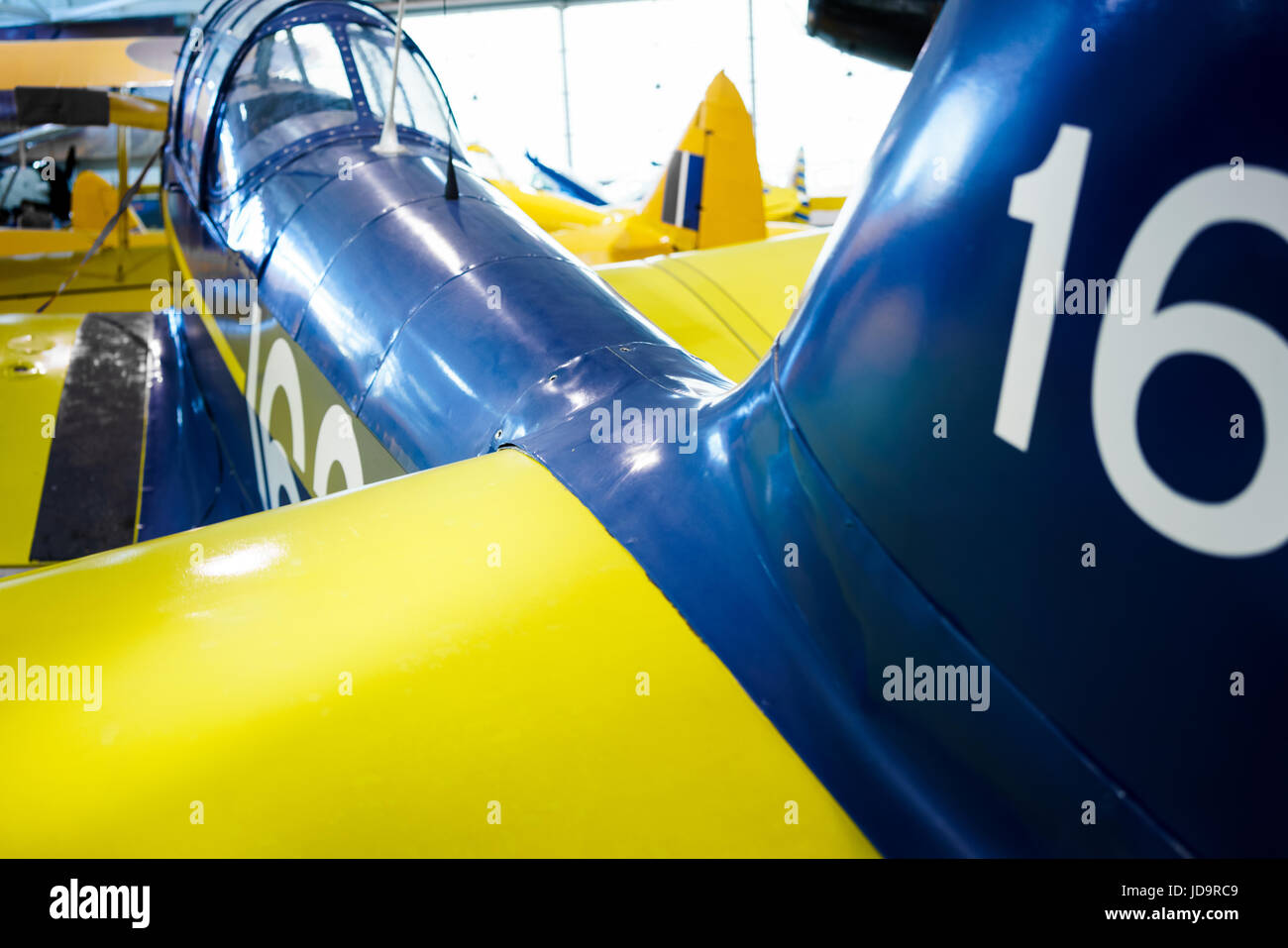 Close up of yellow and blue painted restored, stationary propeller ...
