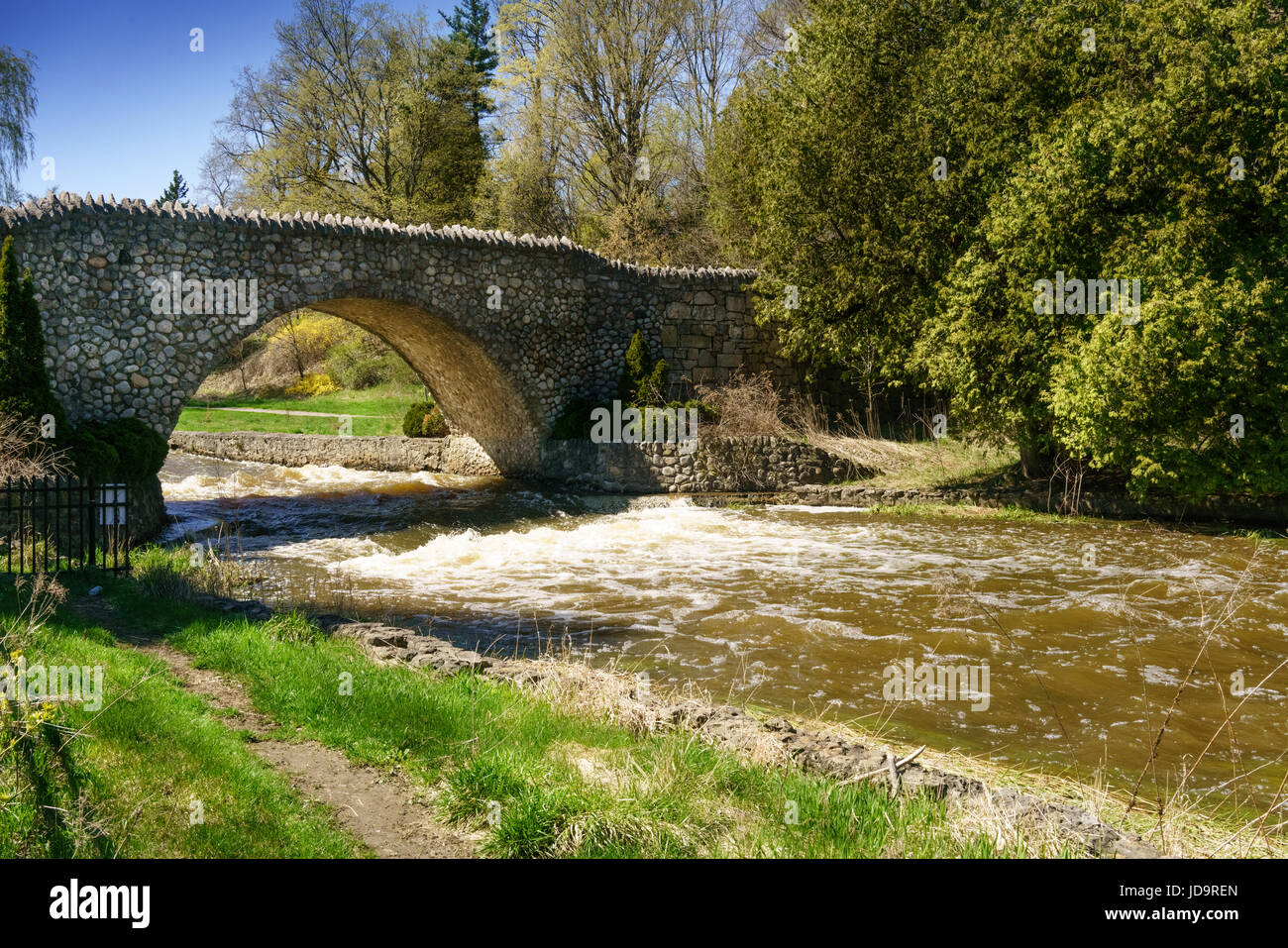 River and arch bridge in rural setting, outdoors, Ontario, Canada Stock ...