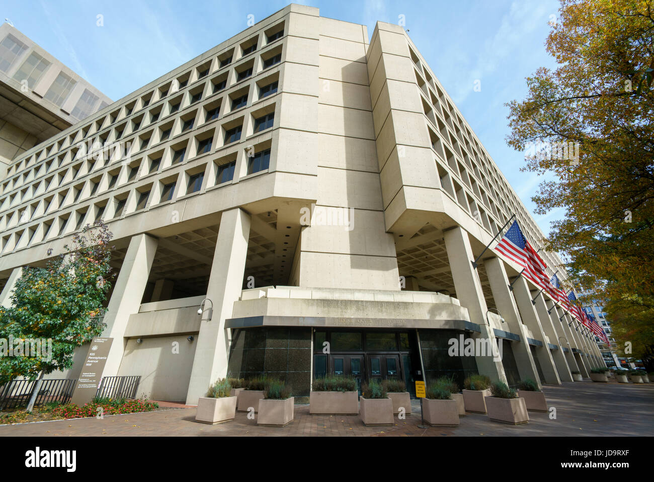 Low angle view, exterior of government building with flags, Washington ...