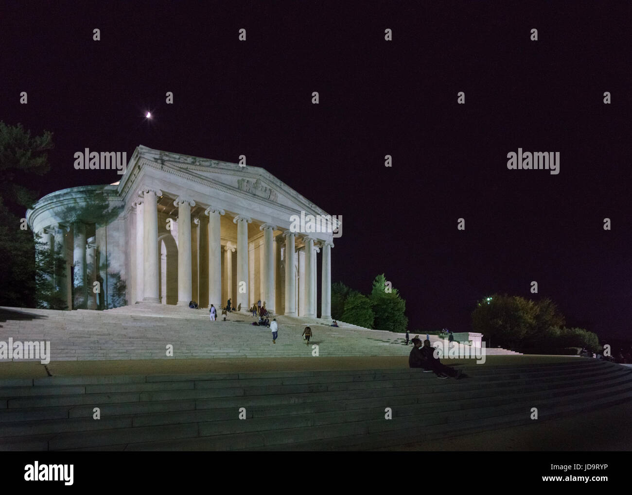 Illuminated exterior of government building at night, Washington DC ...