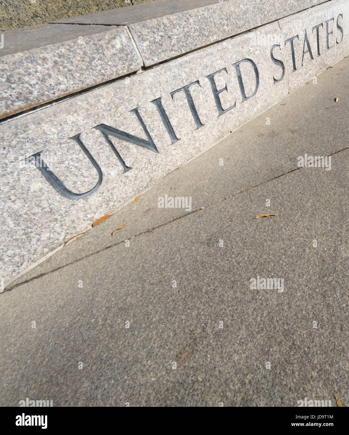 The words United States inscribed in stone, close up, vertical view ...