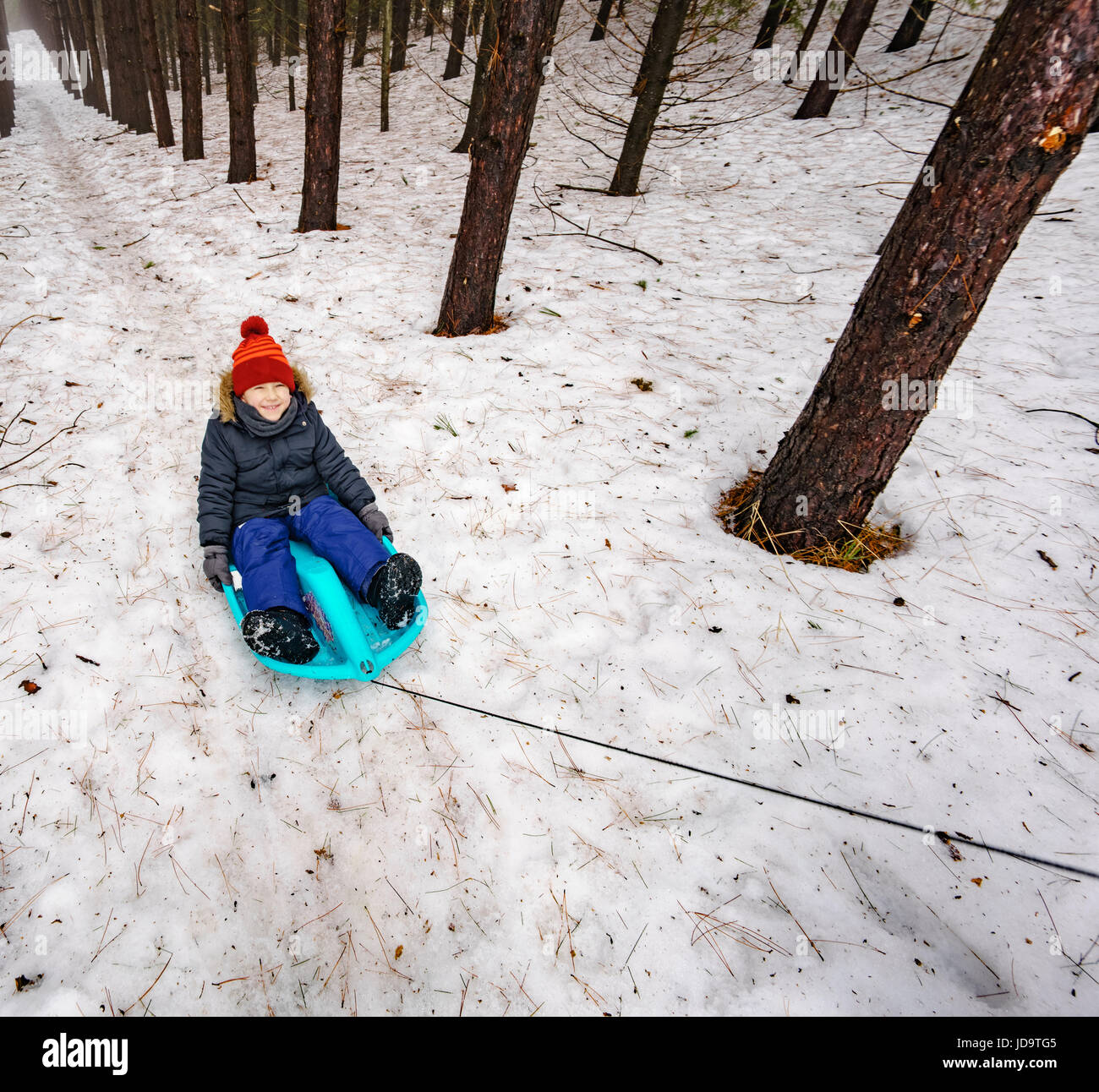 Boy pulling sledge hi-res stock photography and images - Alamy