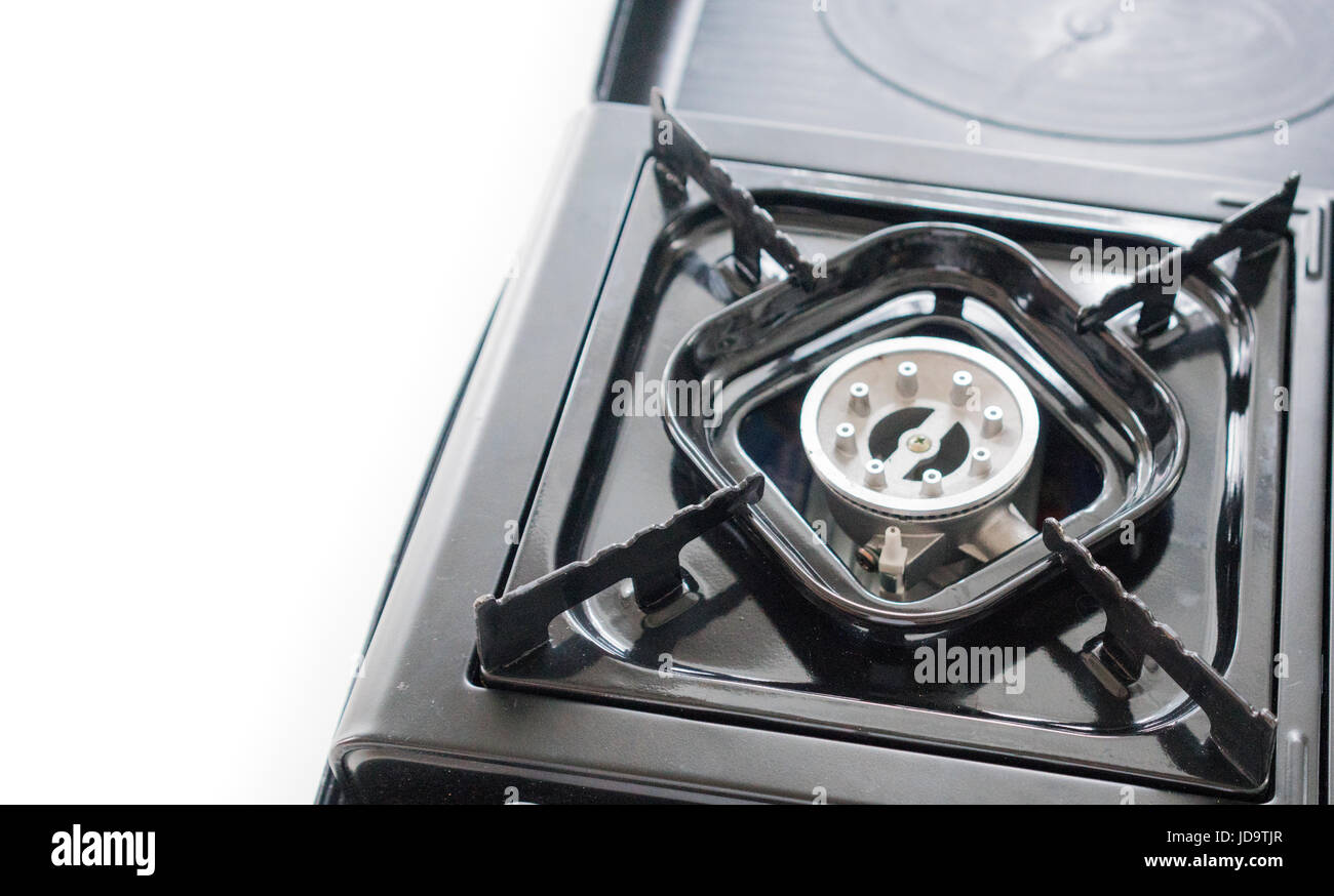 Close-up of cooker hob, showing details of hob, against white ...