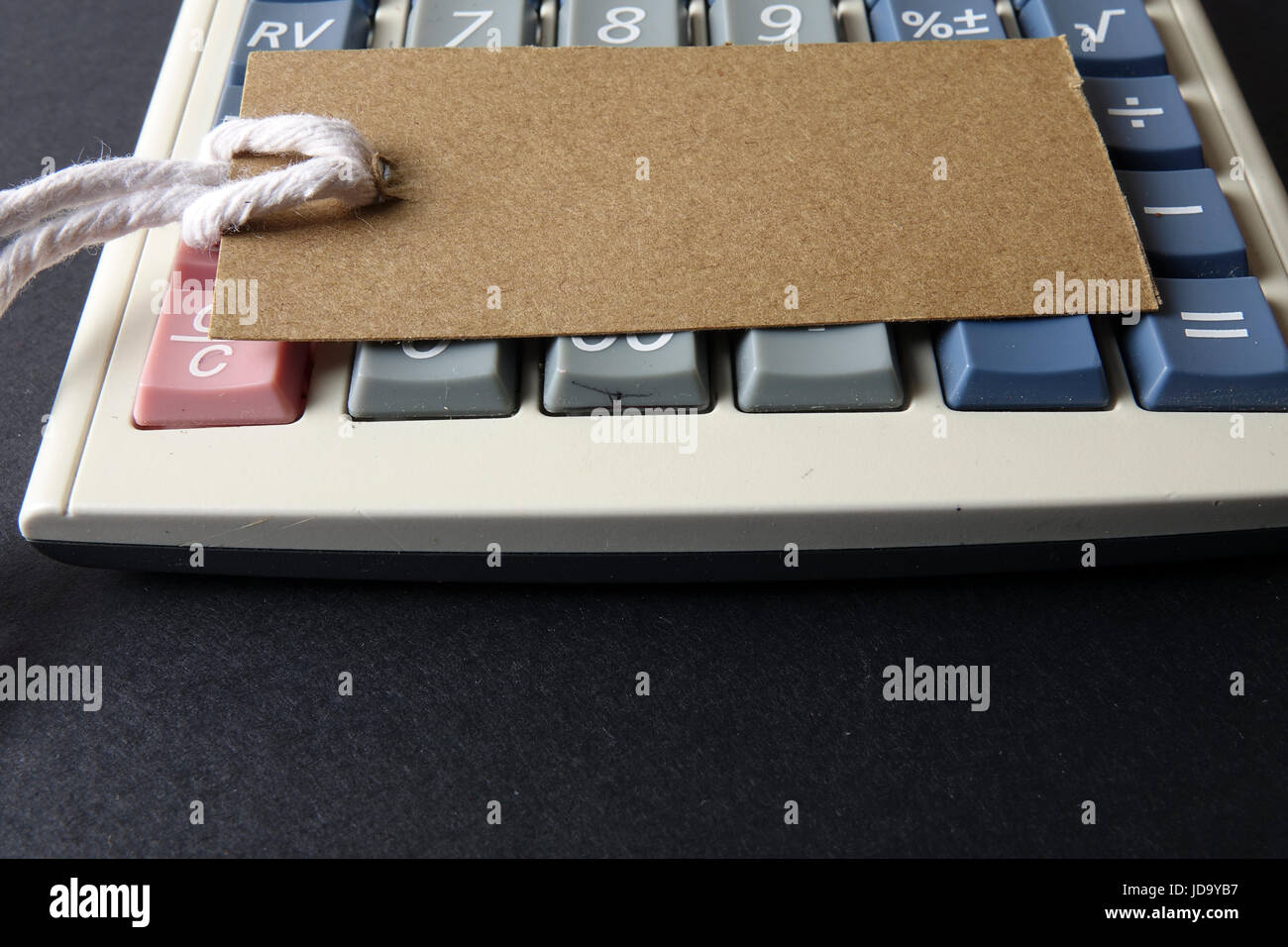 Calculator and note tag. Business concept Stock Photo - Alamy