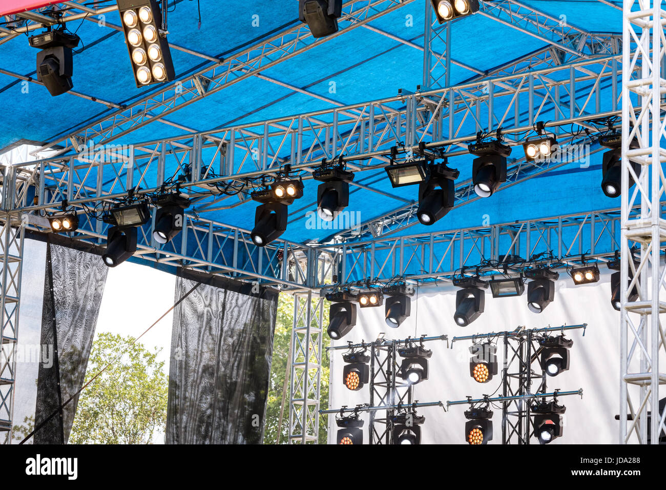outdoor stage equipped with spotlight projectors system before concert ...