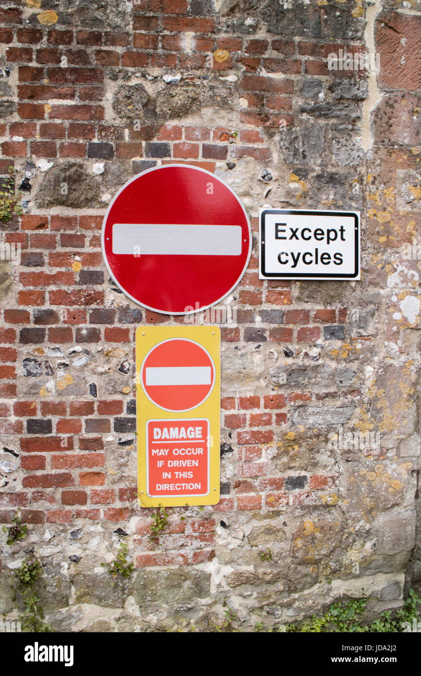 Unsightly modern road signs on a historic building, England, UK Stock ...