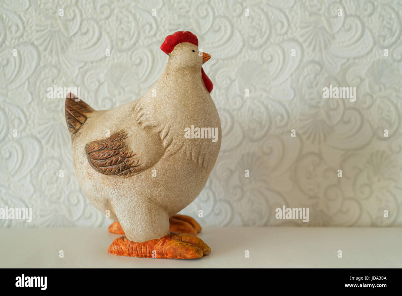 Close up ceramic figurine of hen on shelf Stock Photo - Alamy