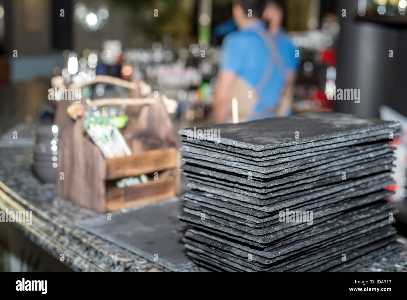 Black graphite sushi slate boards at restaurant Stock Photo - Alamy
