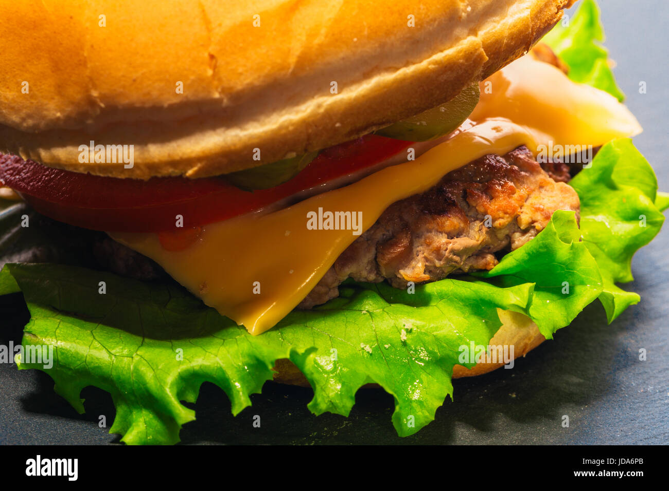 Cheeseburger closeup on a gray background Stock Photo - Alamy