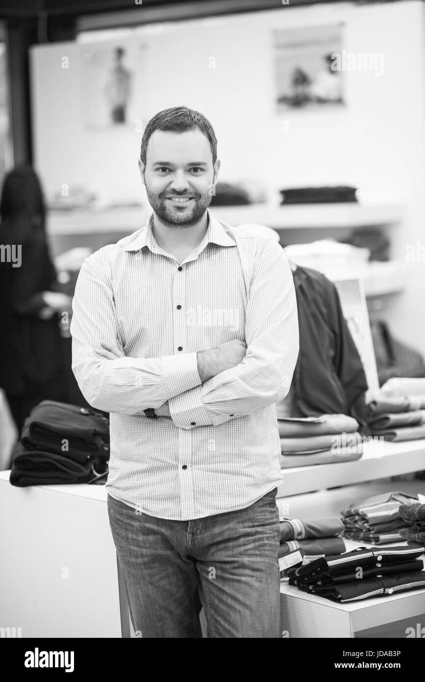 Portrait of an attractive man Shopping In A Man's Clothing Store Stock ...