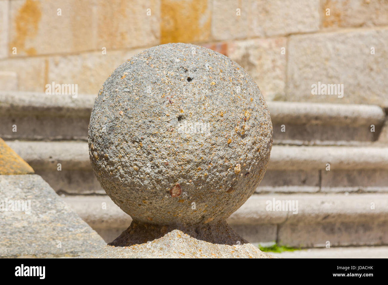 Stone sculpture of a round ball Stock Photo - Alamy