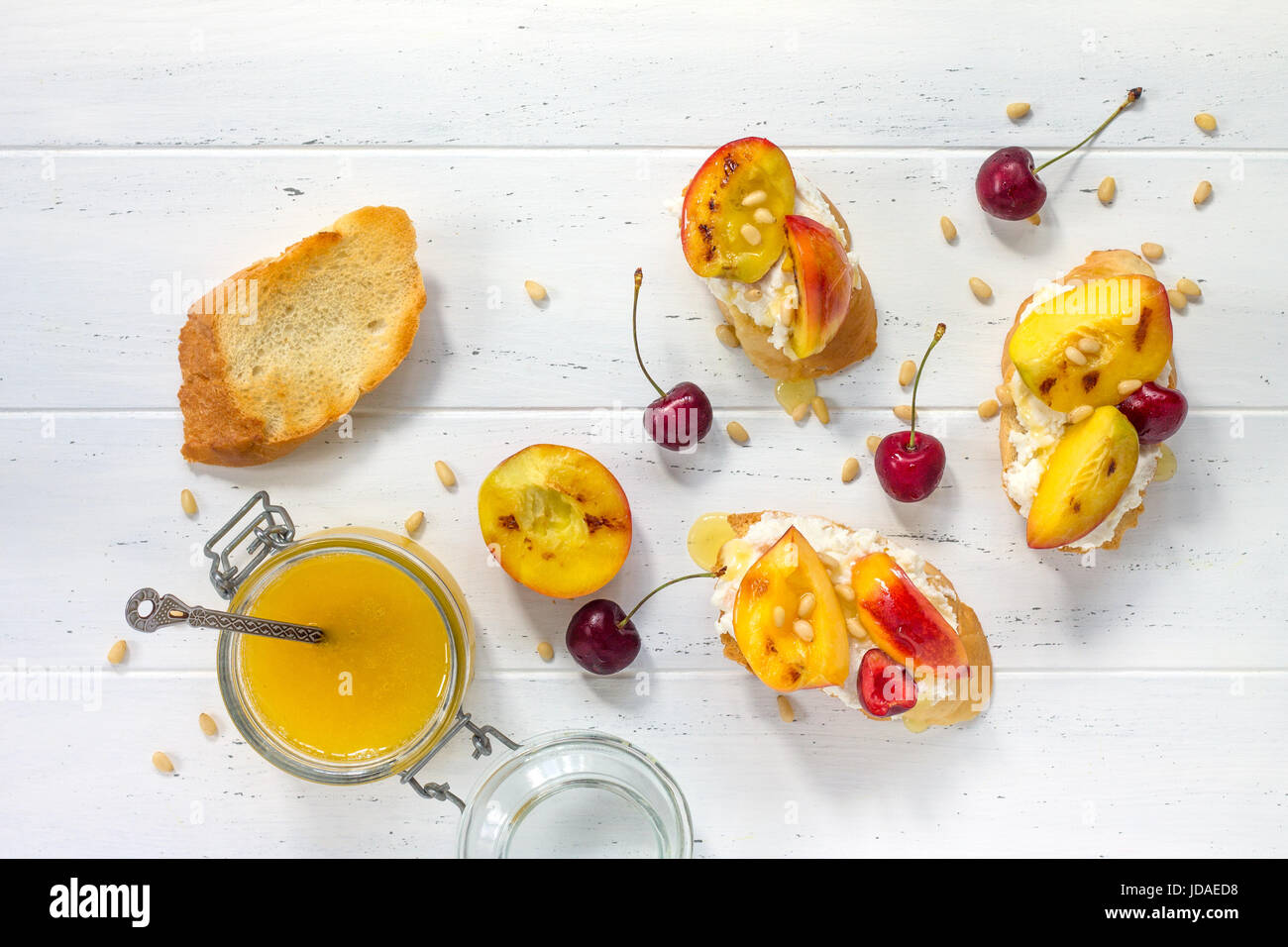 Homemade fresh sweet toasted toast with fruit. Peach and cherry ...