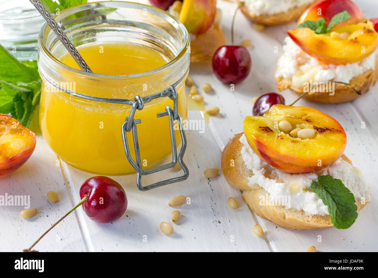 Homemade fresh sweet toasted toast with fruit. Peach and cherry ...