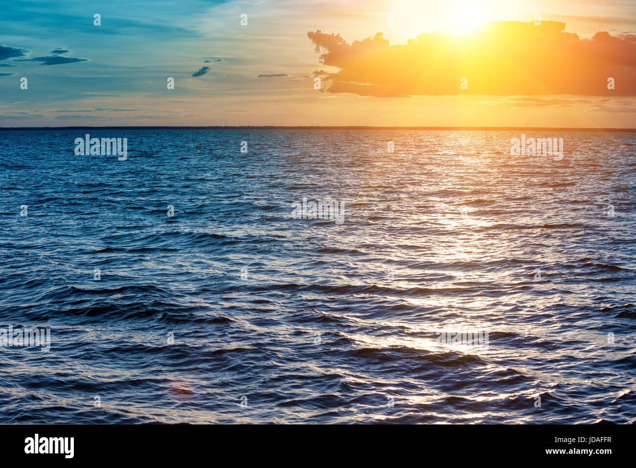Evening on the beach, sunset over sea Stock Photo - Alamy